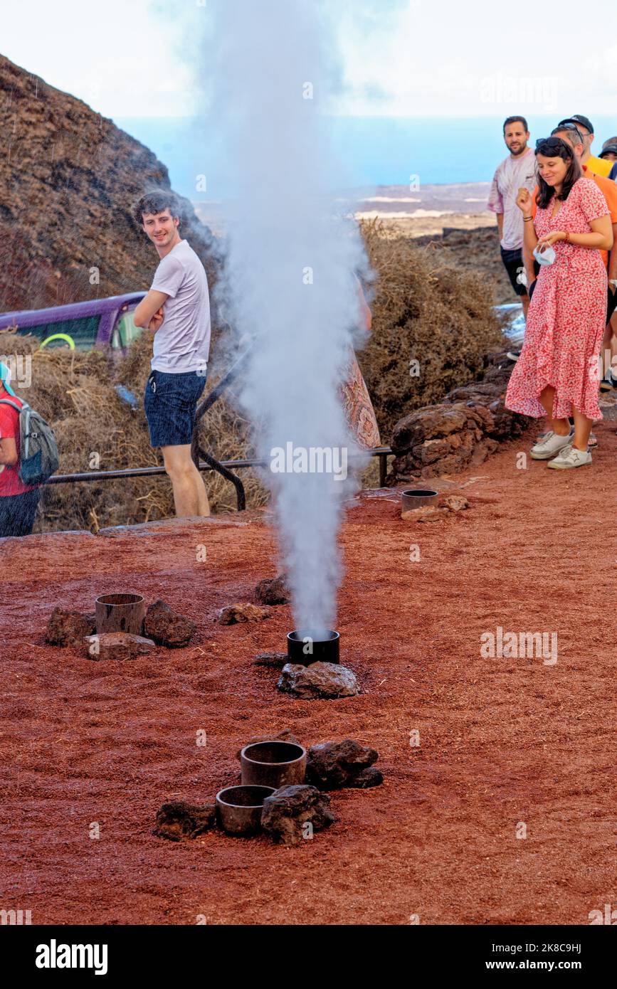 Steam vent or geyser on Montanas del Fuego. Demonstration of artificial ...