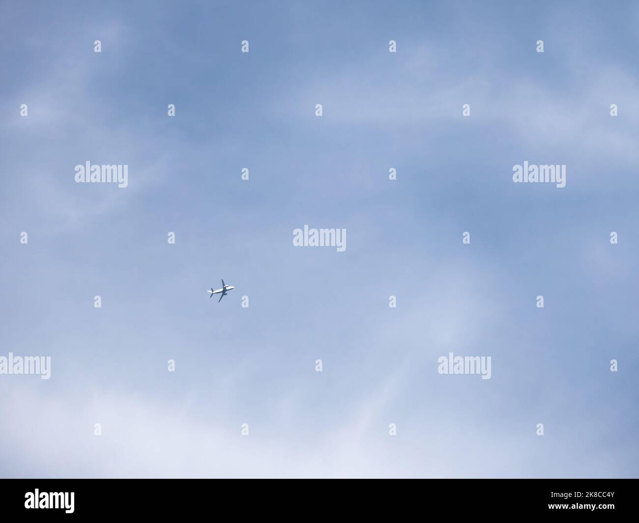 Airplane is flying in clear blue sky. Aircraft in flight in good ...