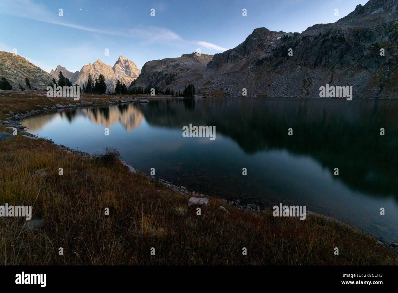 Stars beginning to shine late in twilight over the Cathedral Group and ...