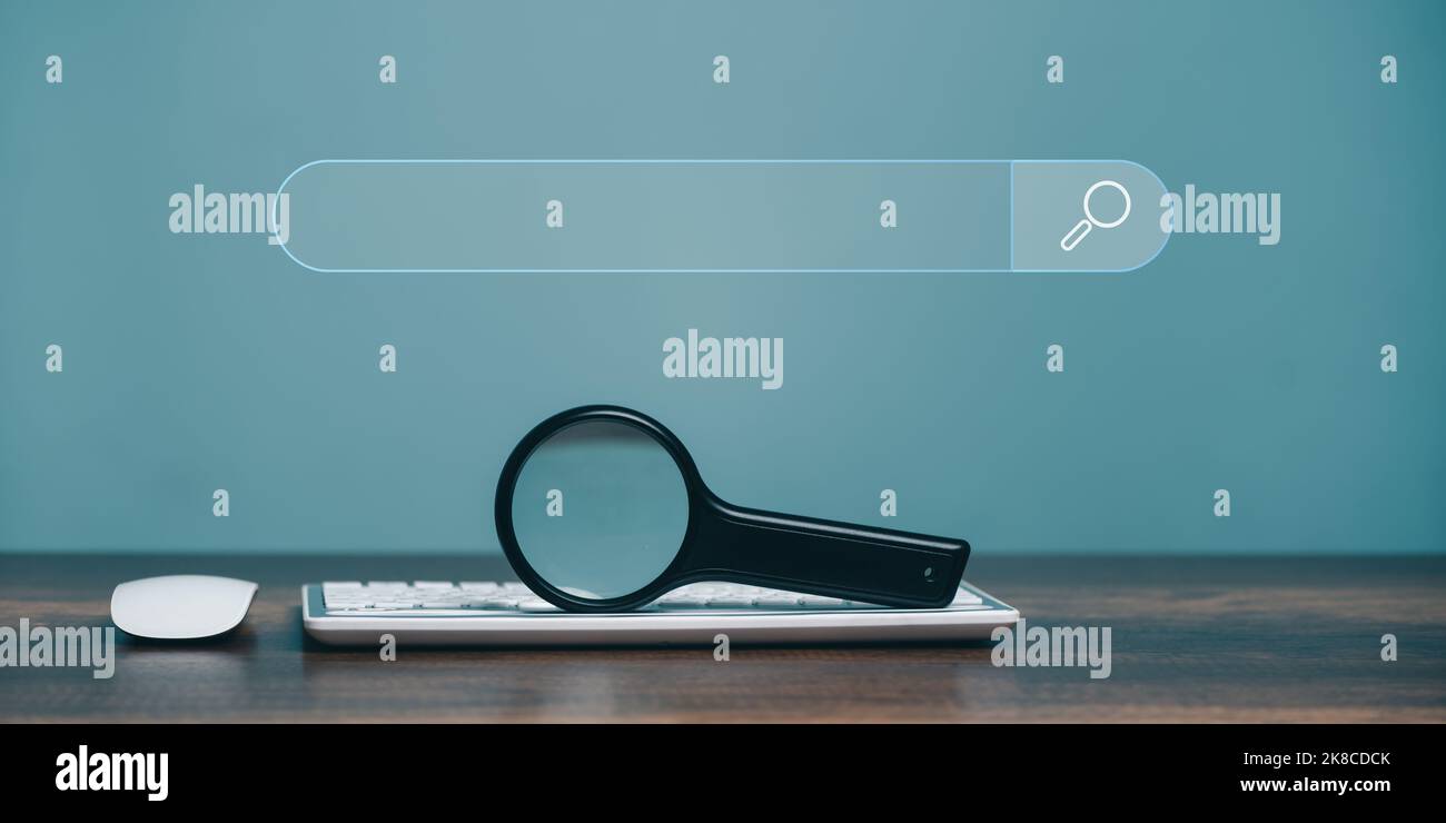 Magnifying glass keyboard computer and search bar or search box on ...