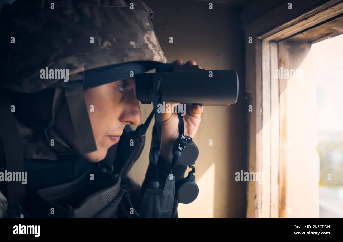 A Man with a binocular and in the military uniform Stock Photo - Alamy
