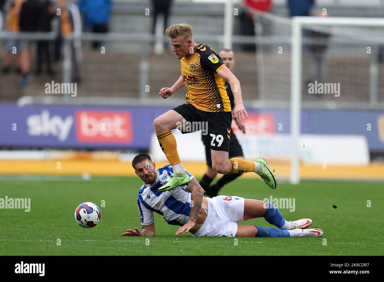 Newport, UK. 22nd Oct, 2022. Will Evans of Newport County (29) jumps ...