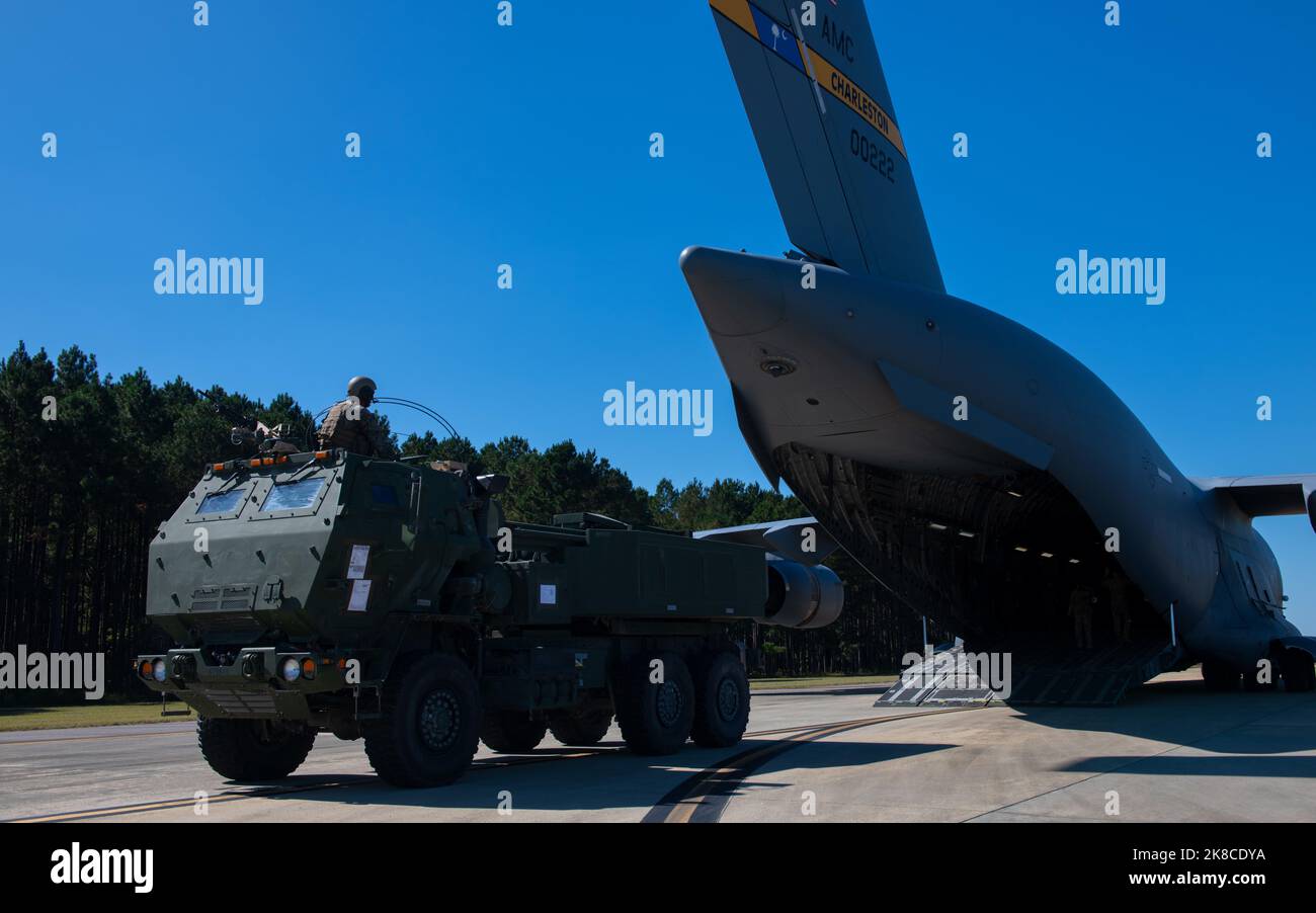 U.S. Air Force personnel work with U.S. Marine personnel during a joint ...
