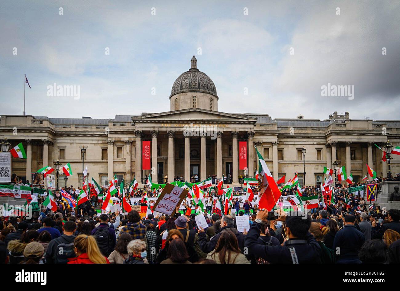 London, UK. 22nd Oct, 2022. Demonstrators hold Iranian flags to demand ...