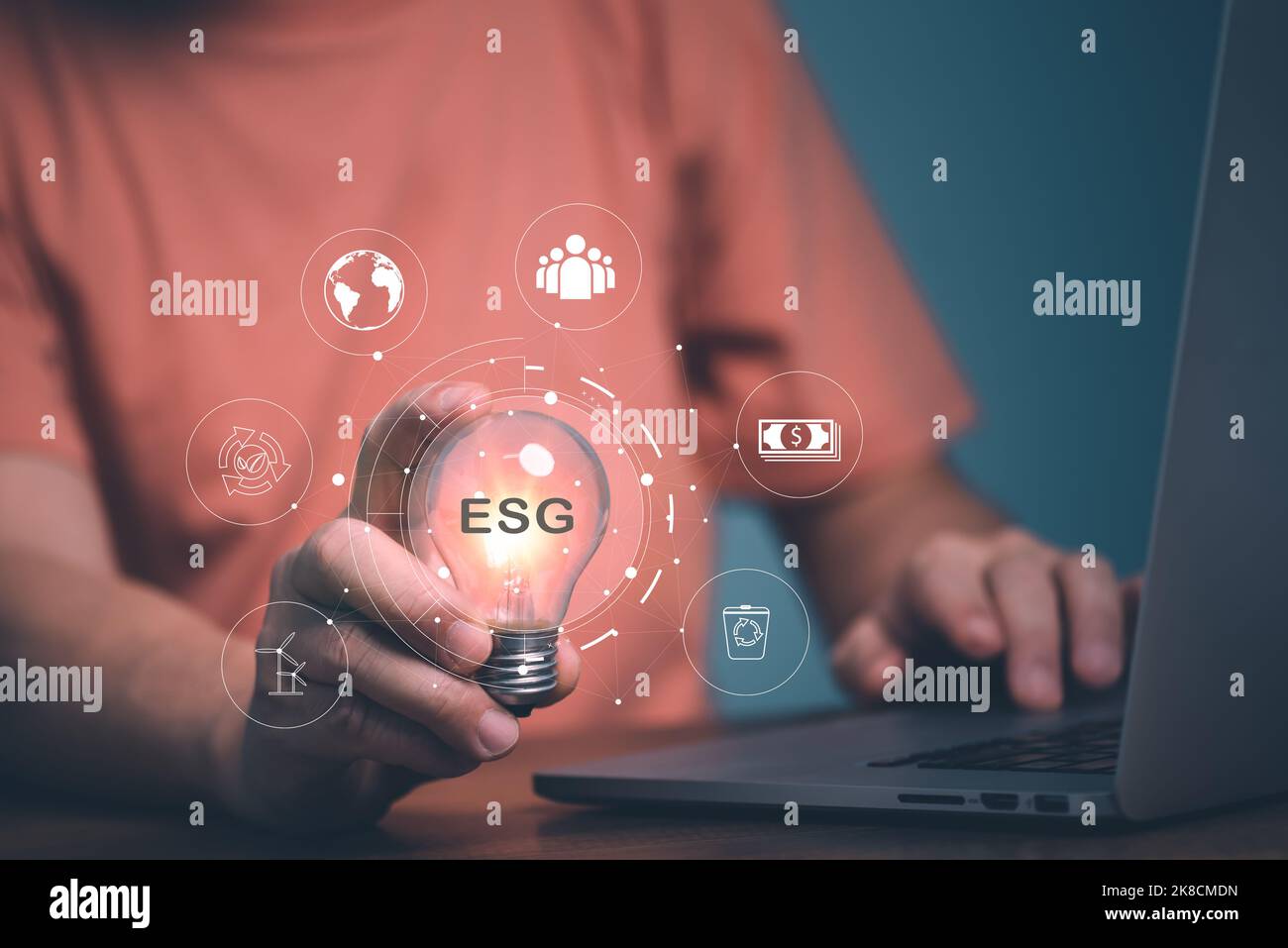 ESG concept, Man hand holding light bulb with ESG icon for ...