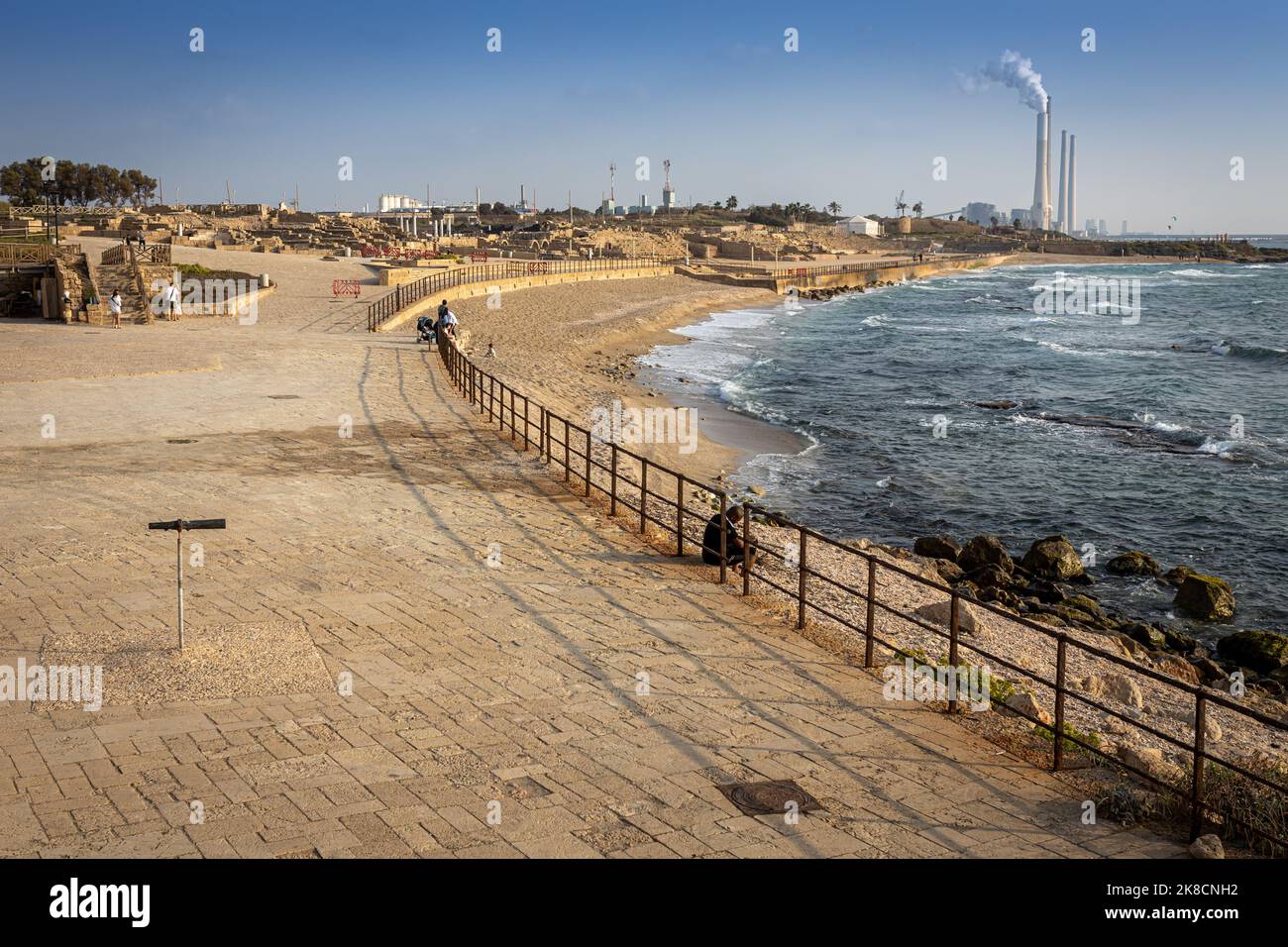 CAESAREA, Israel - August 11 2022:Tourists at Caesarea ancient port ...