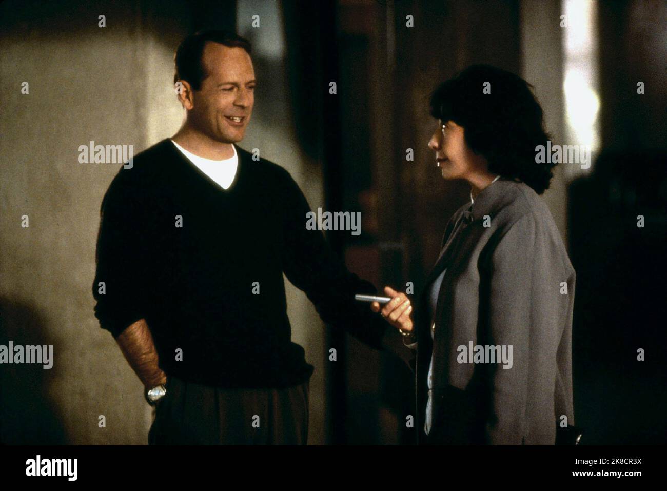 Bruce Willis & Lily Tomlin Film: The Kid (2000) Characters: Russ Duritz & Janet Director: Jon ...