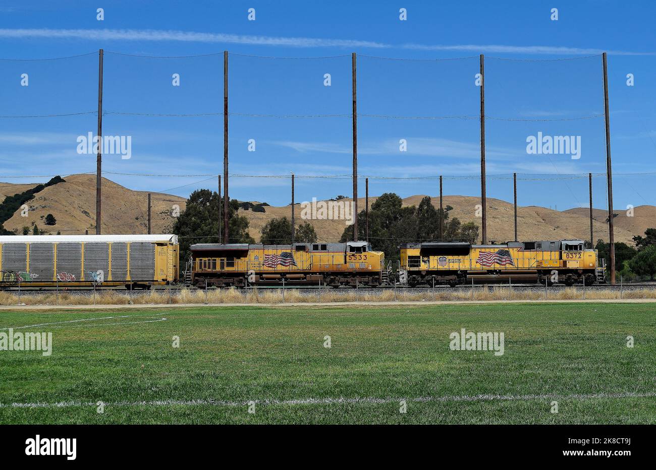 freight train passes a park in Fremont California Stock Photo - Alamy
