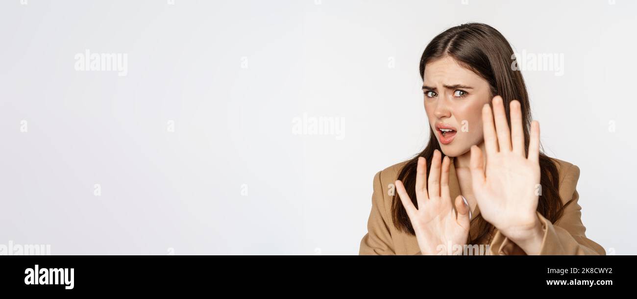 Close up portrait of disgusted, shocked woman cringe, turn away and ...