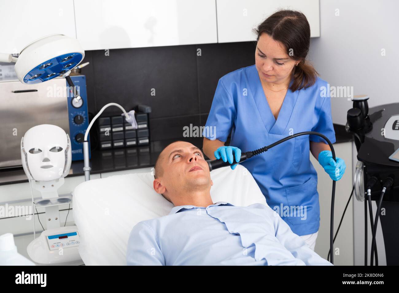 Man getting face skin rf lifting procedure in clinic of aesthetic ...