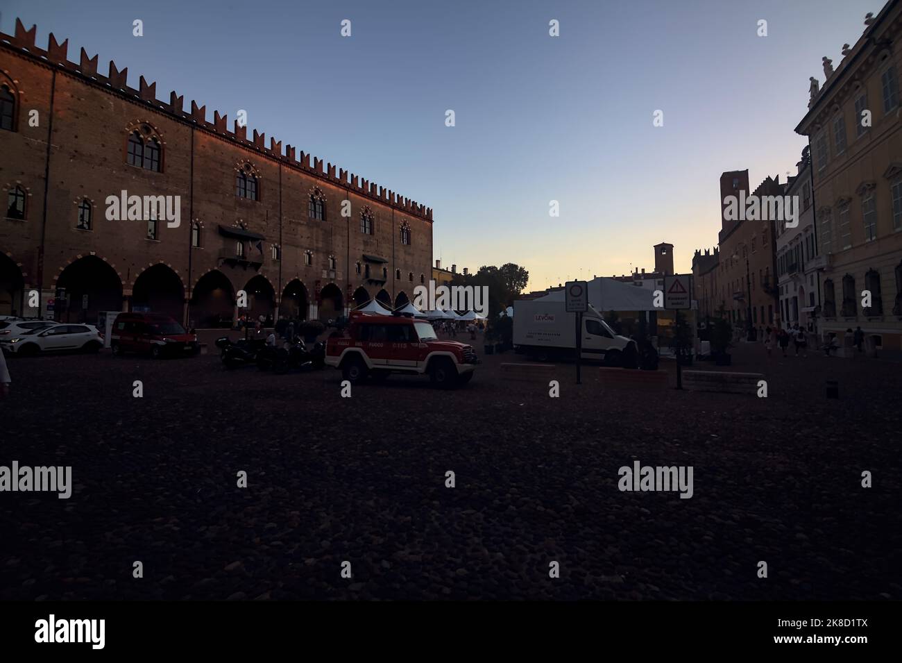 Sordello square with cars and tents at dusk Stock Photo - Alamy