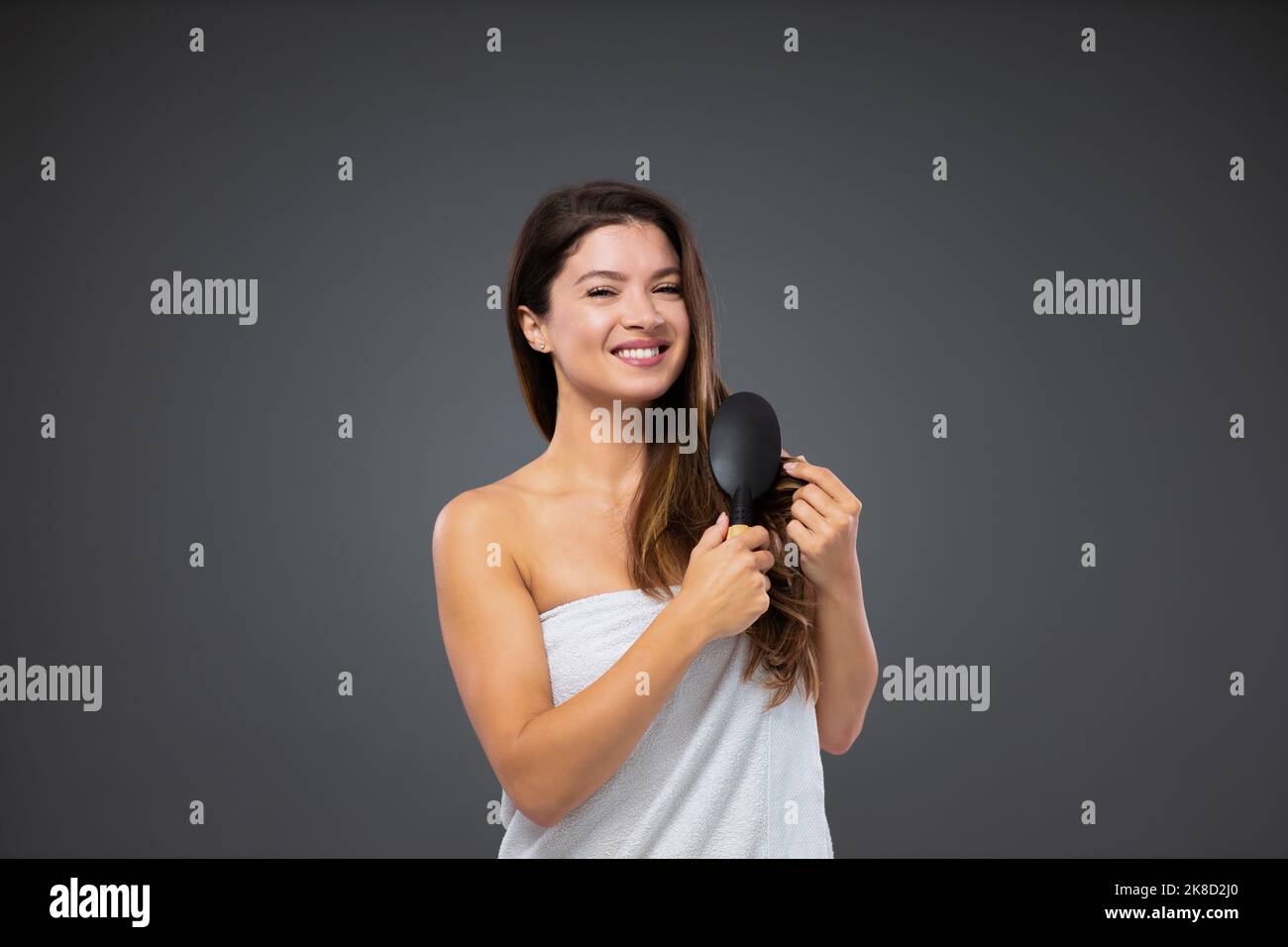 Beautiful And Well Groomed Woman Female Wrapped In A White Towel