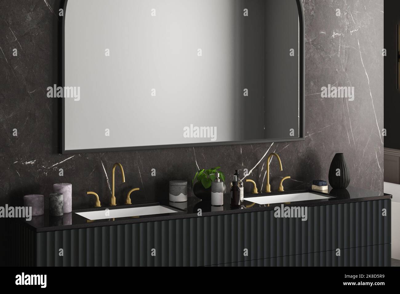 Close up of double sink with oval mirror standing in on marble wall ...