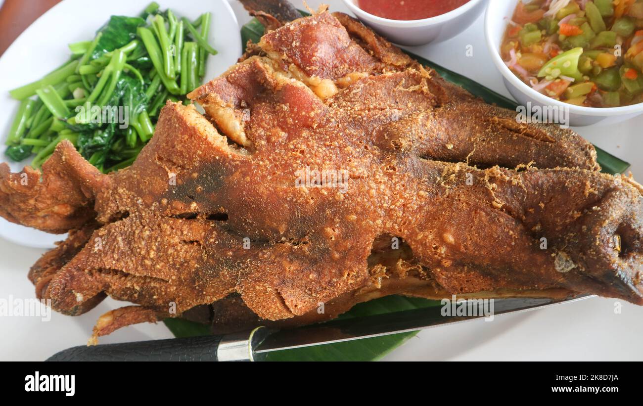 very tasty and delicious fried pork head Stock Photo - Alamy