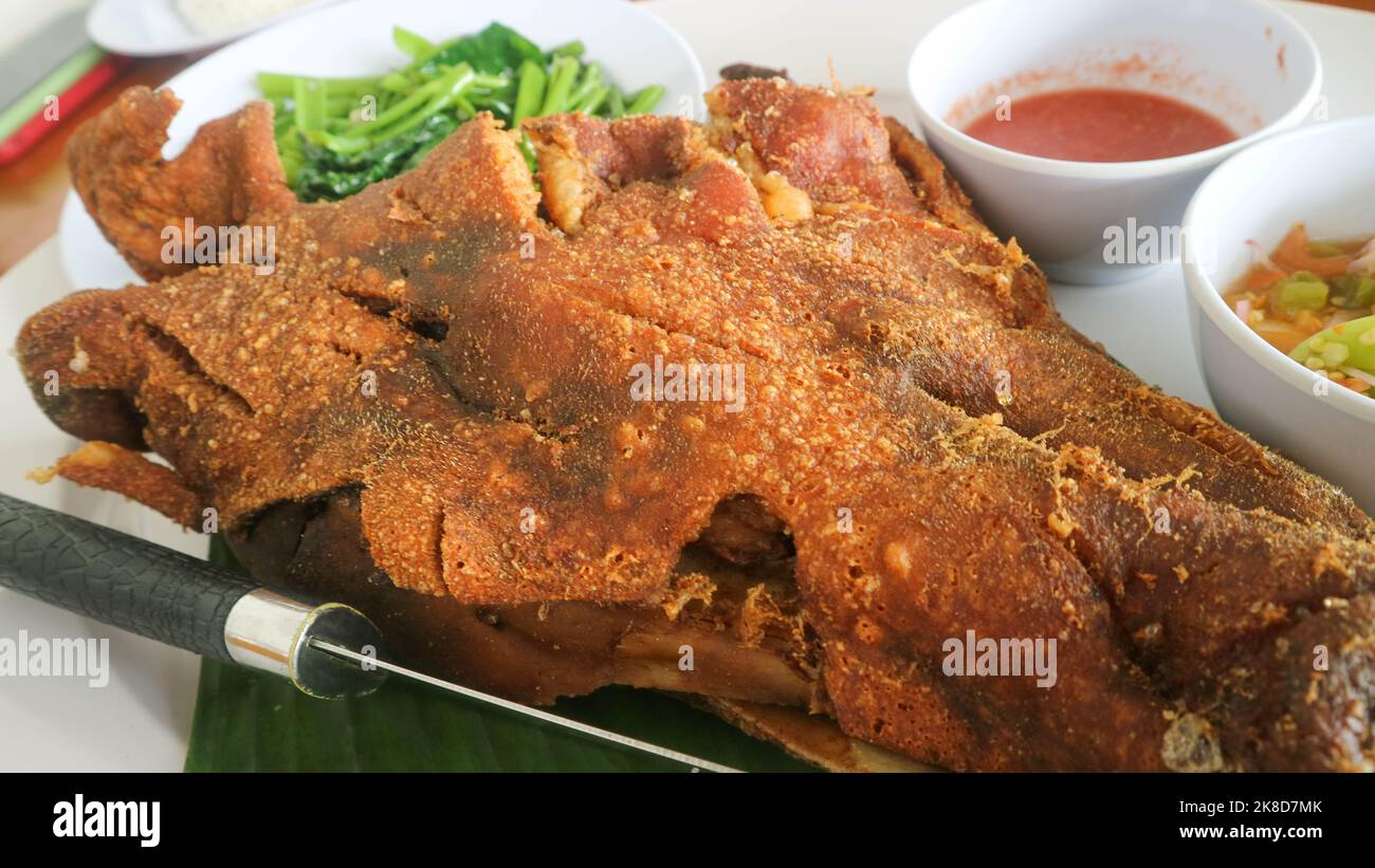 very tasty and delicious fried pork head Stock Photo - Alamy