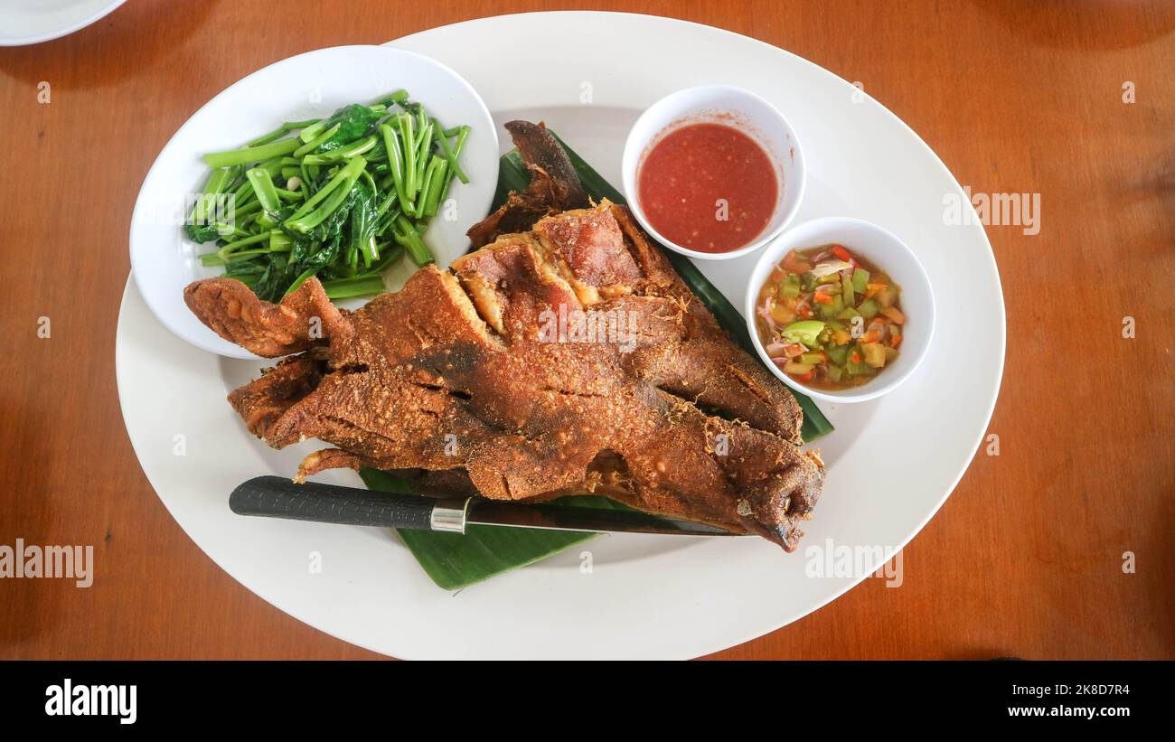 very tasty and delicious fried pork head Stock Photo - Alamy