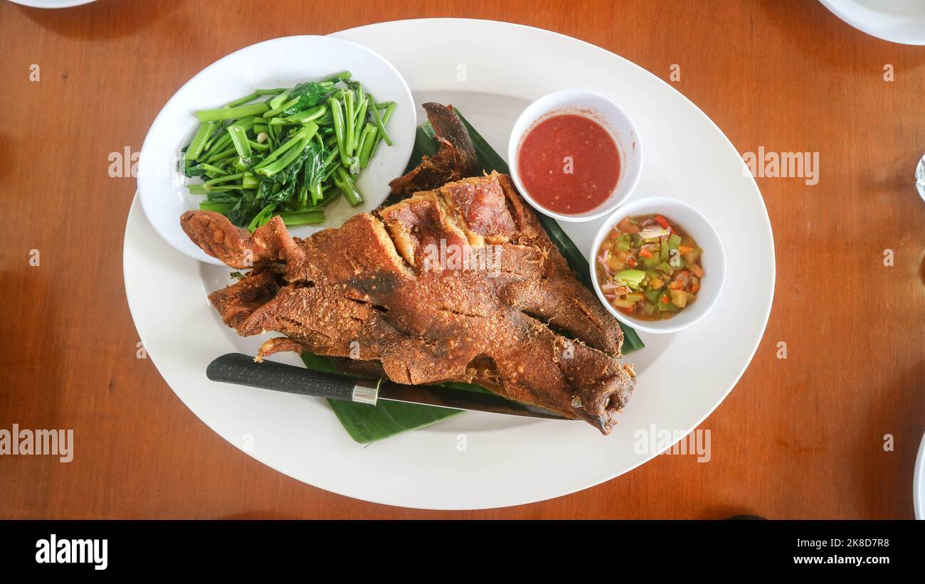 very tasty and delicious fried pork head Stock Photo - Alamy