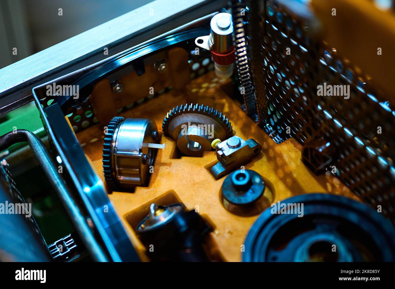 Various parts for assembly during the assembly of an automobile engine ...