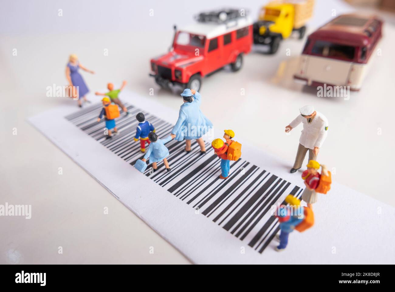 Miniature toys school kids walk on cross road bar code - school ...