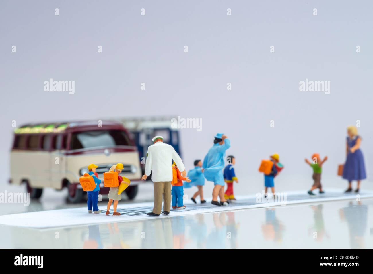 Miniature toys school kids walk on cross road bar code - school ...