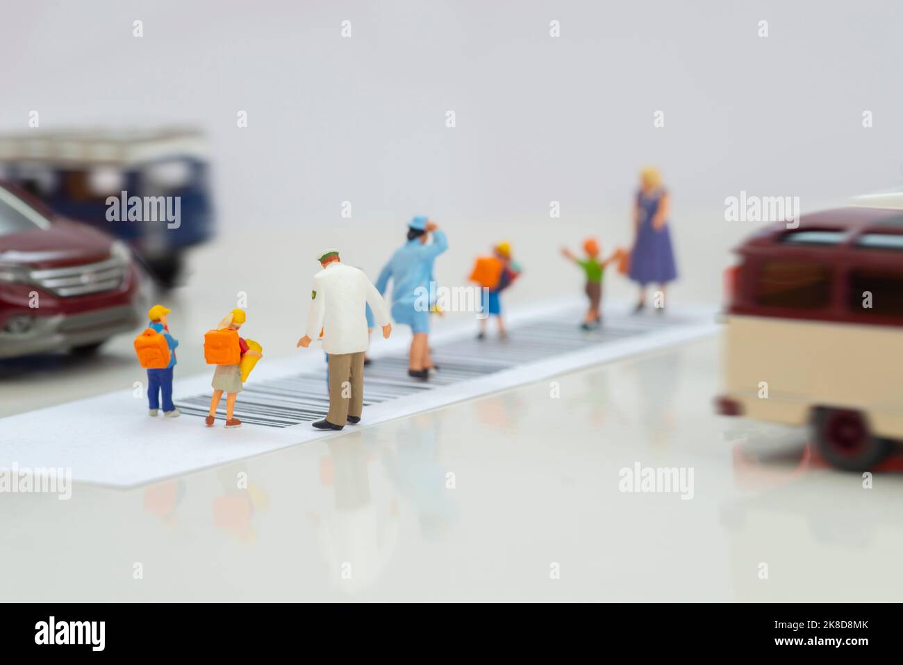 Miniature toys school kids walk on cross road bar code - school ...