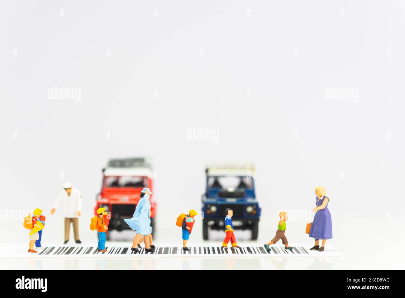 Miniature toys school kids walk on cross road bar code - school ...