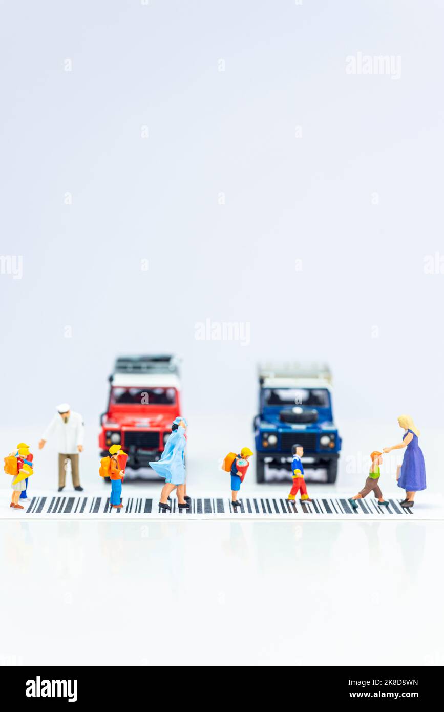 Miniature toys school kids walk on cross road bar code - school ...