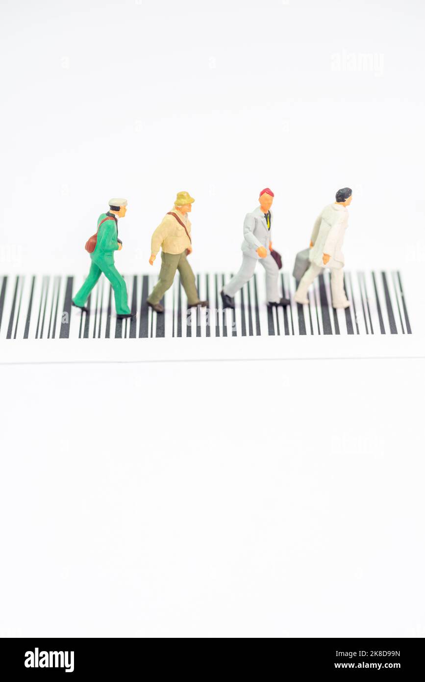 Miniature toys a group of people crossing a road - road safety concept ...