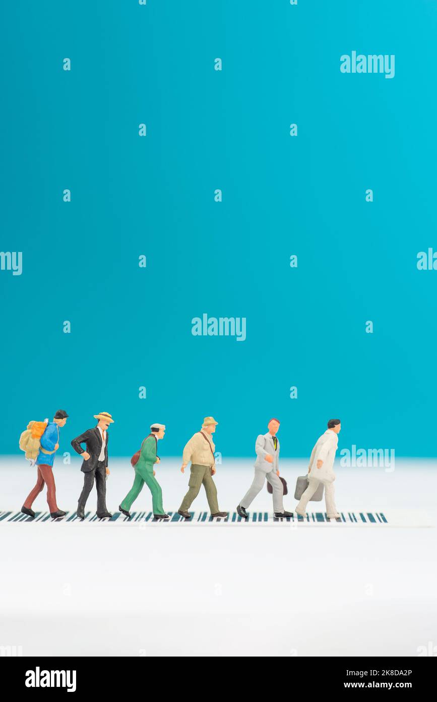 Miniature toys a group of people crossing a road - road safety concept ...