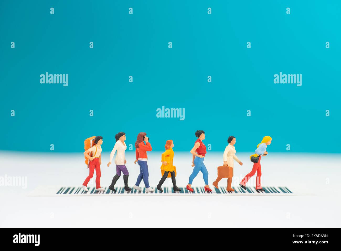 Miniature toys a group of women crossing a road - road safety concept ...