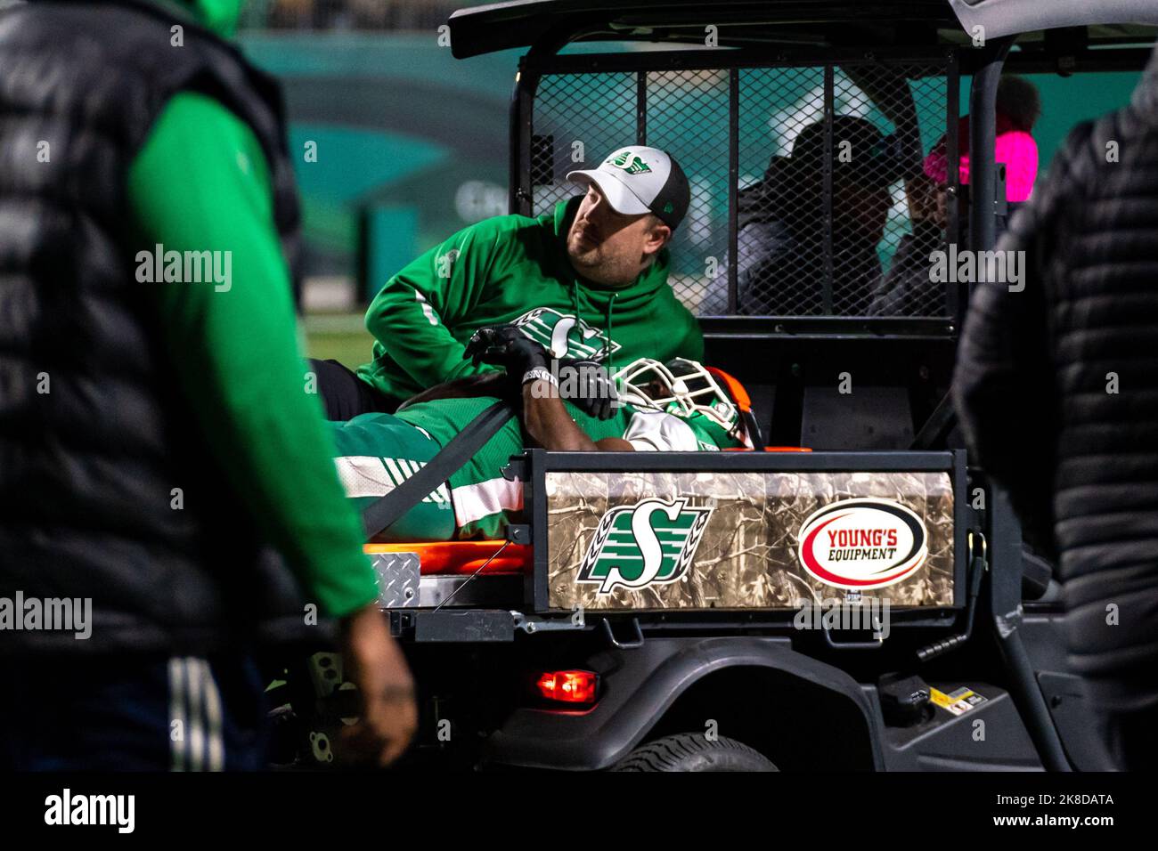 Saskatchewan Roughriders safety Mike Edem (15) is assisted off the ...