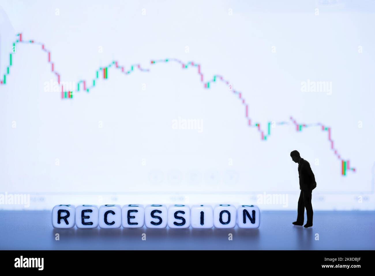 Miniature figurines silhouette - economic downturn or recession concept ...