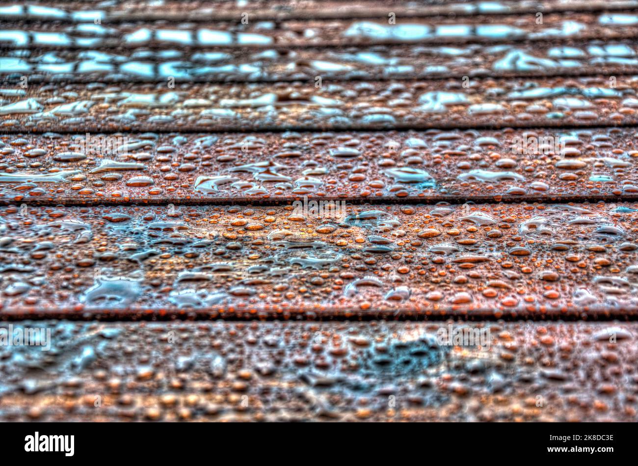 Water beading up on a freshly stained wooden deck Stock Photo - Alamy