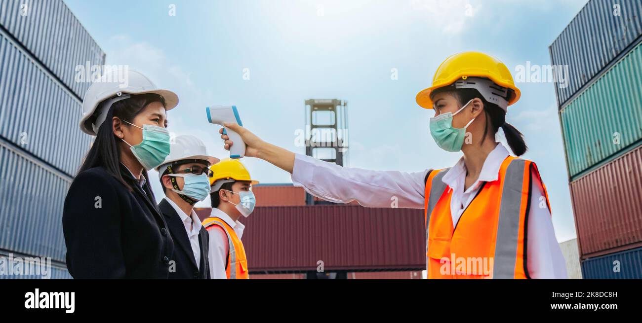 asian business woman and team wearing face mask checking fever by ...