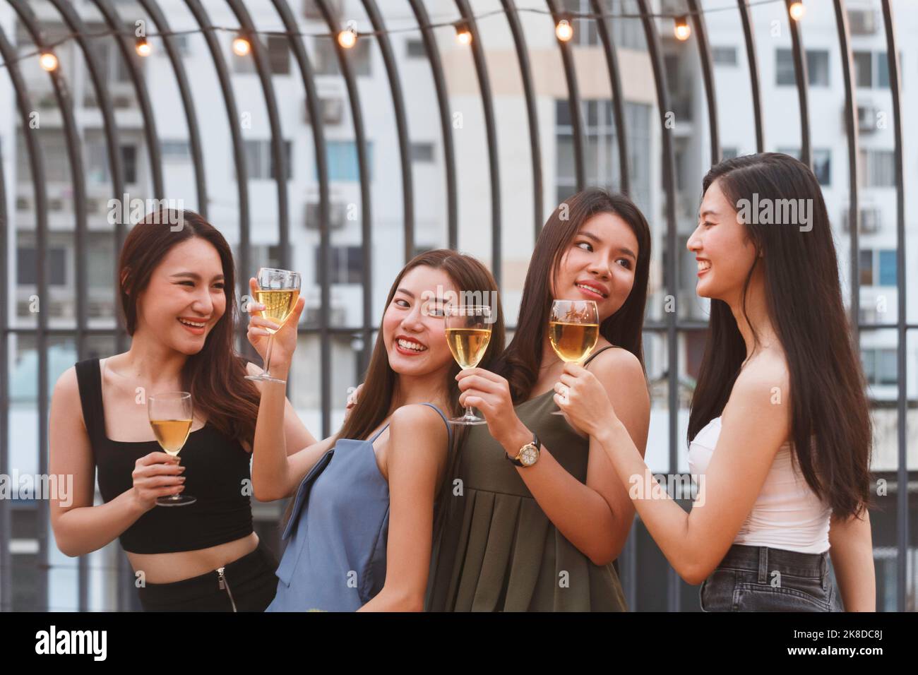 asian woman teenagers cheering and toast with white sparkling wine ...