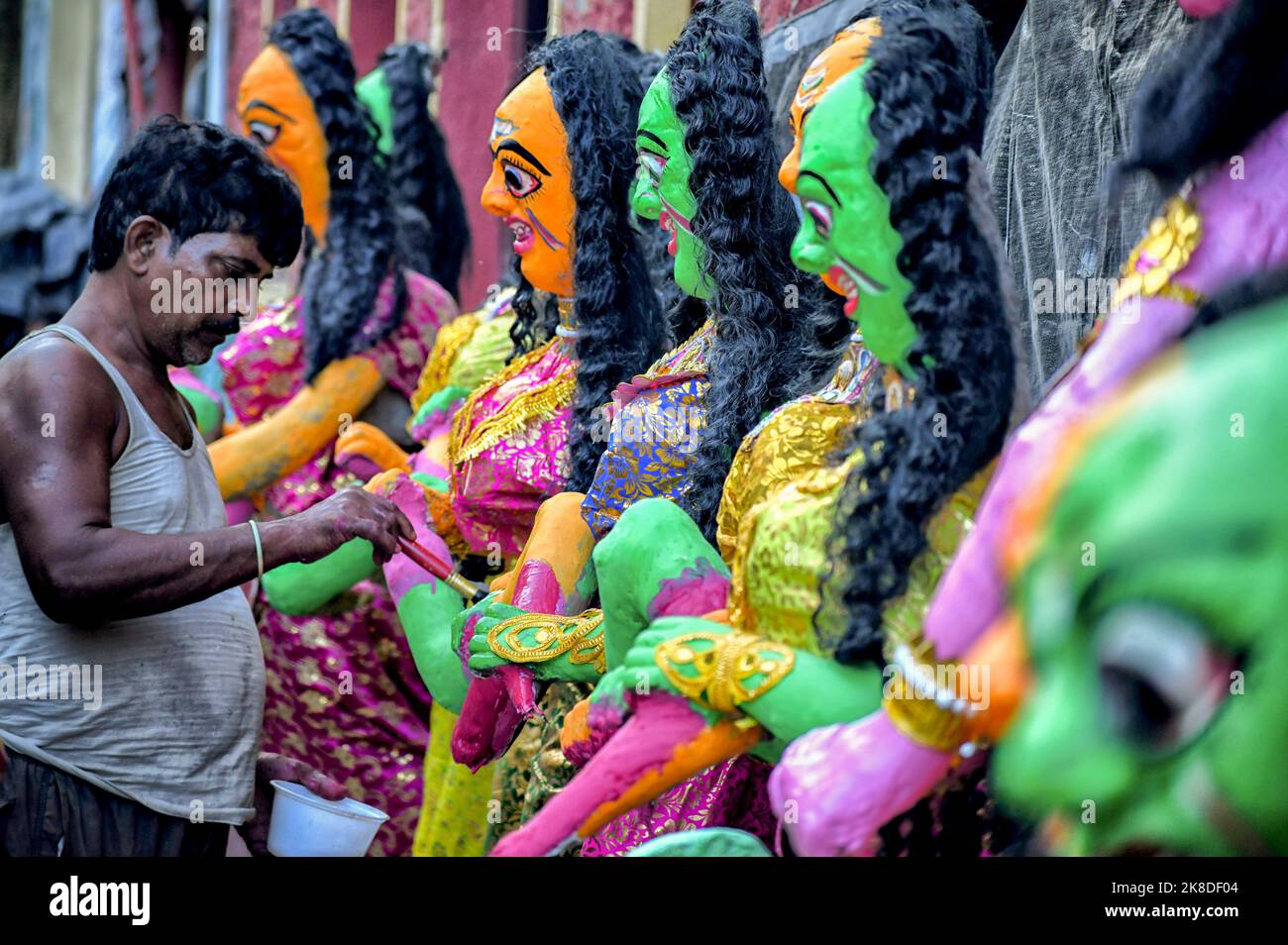 An artist makes final touches to the demon clay sculpture at Kumartuli ...