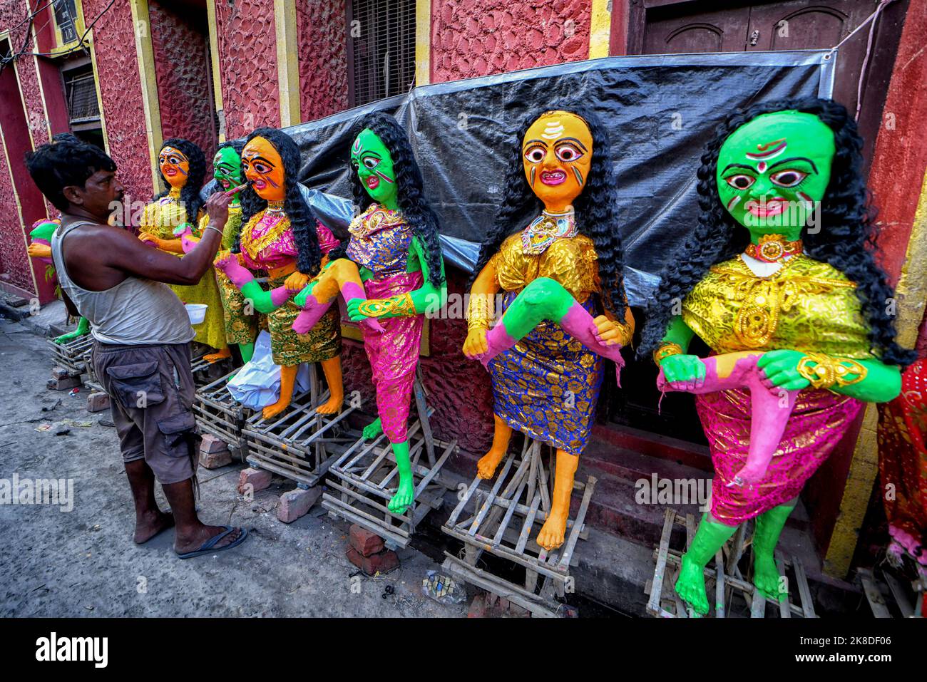 An artist makes final touches to the demon clay sculpture at Kumartuli ...