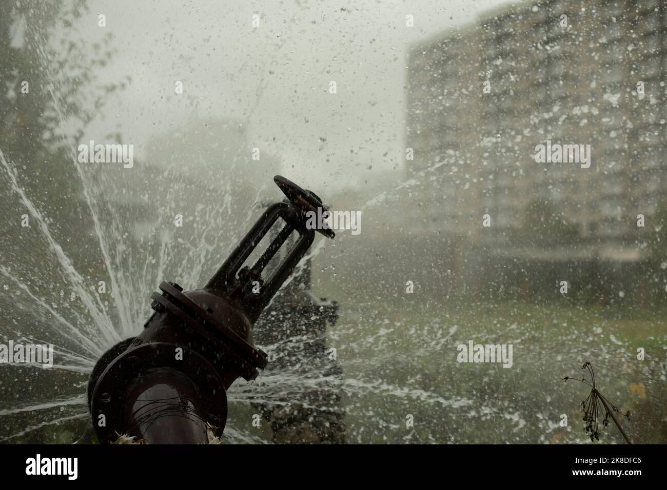 Pipeline accident. Boiling water pours from pipe. Boiler room emergency ...