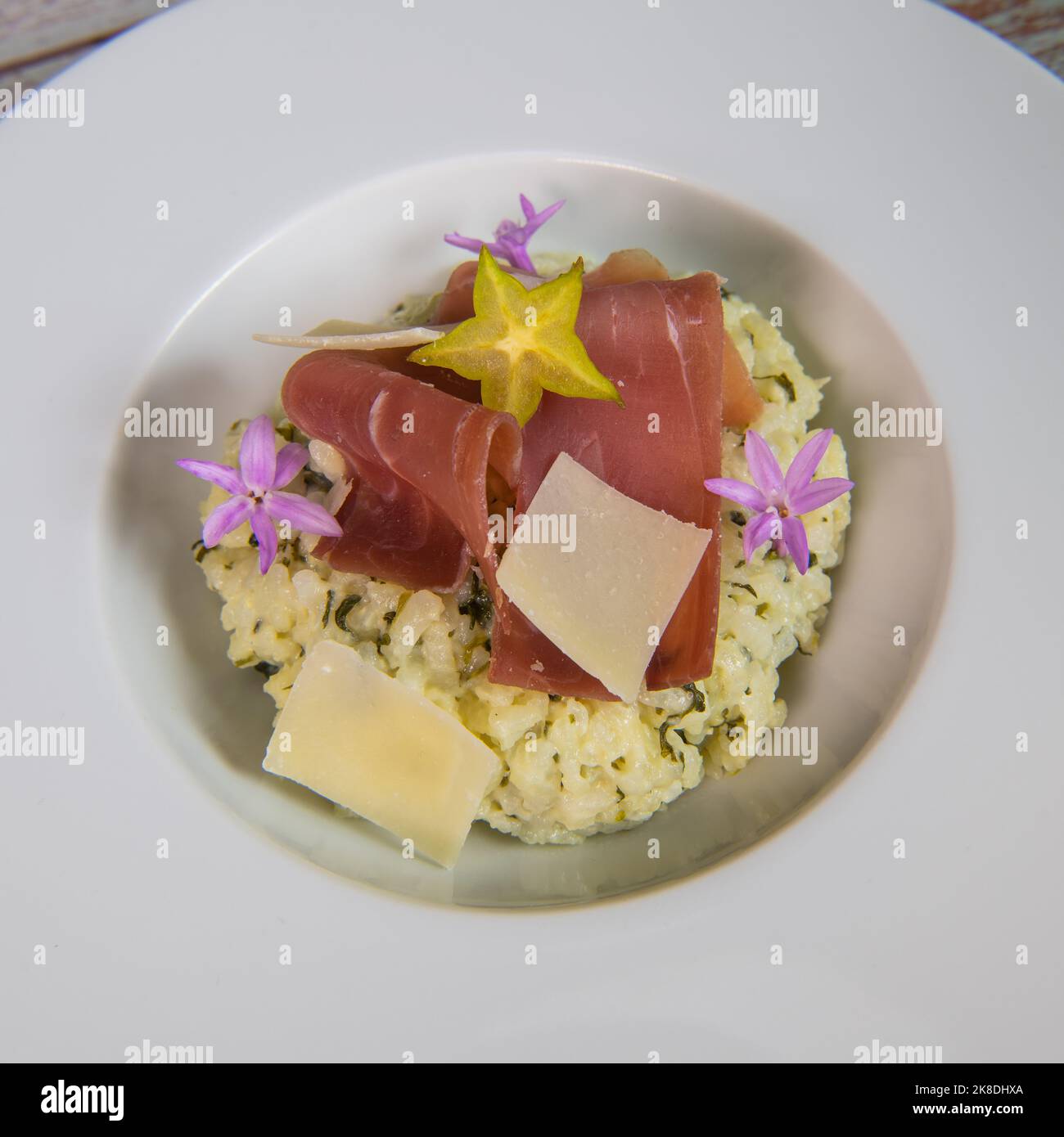 Recipe for risotto with dry ham, parmesan and rocket Stock Photo - Alamy