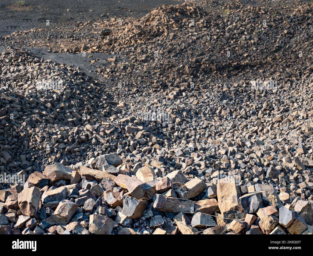 Basalt quarry. Marks of excavator operating in a rock quarry.The ...