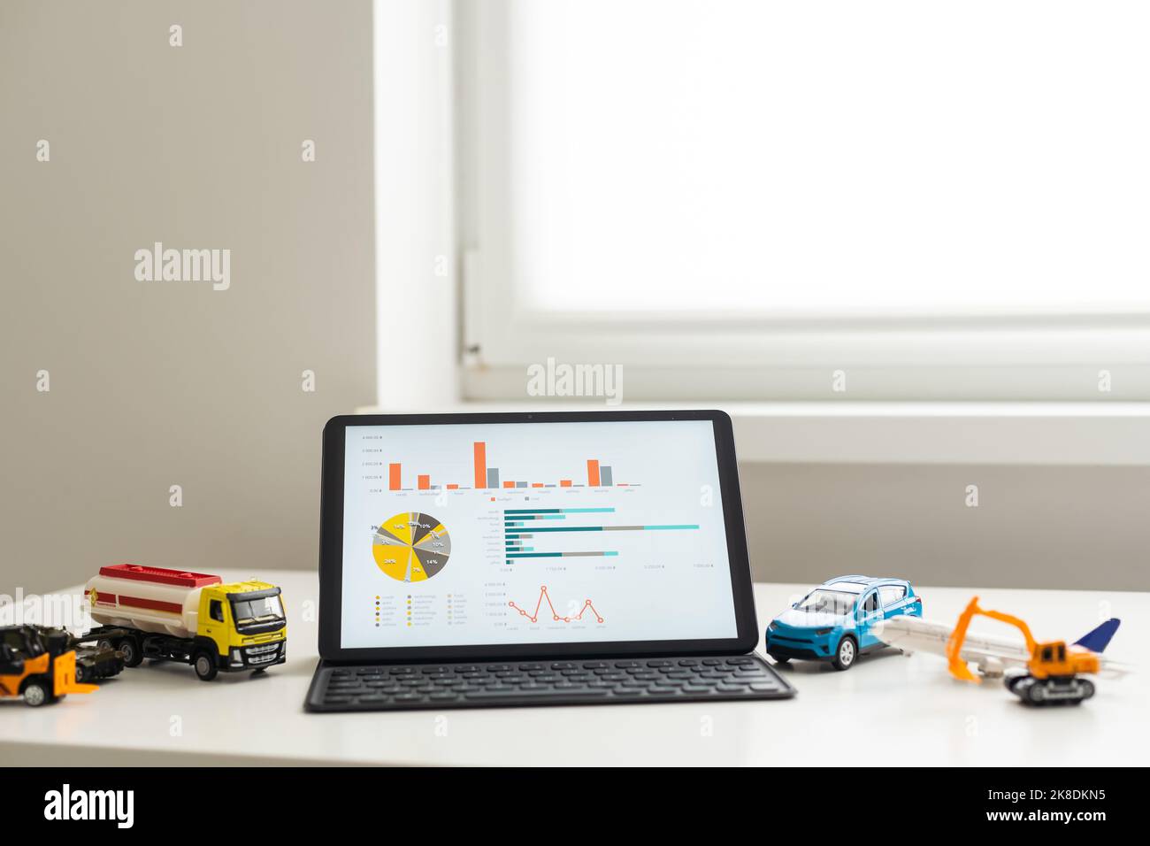 Tablet computer with different types of toy transport. auto center ...