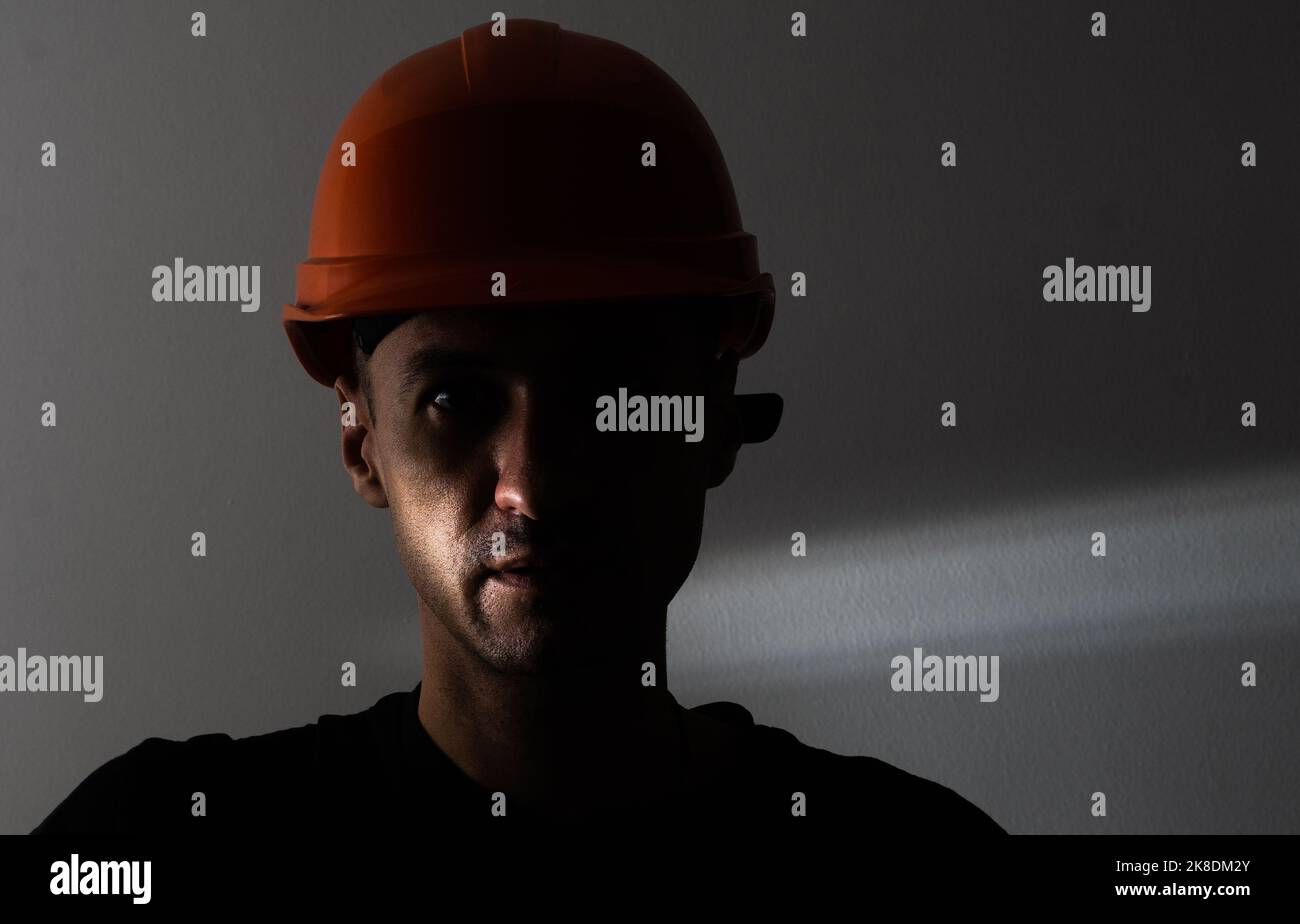 Dirty face of coal miner on a black background. Head of tired mine ...