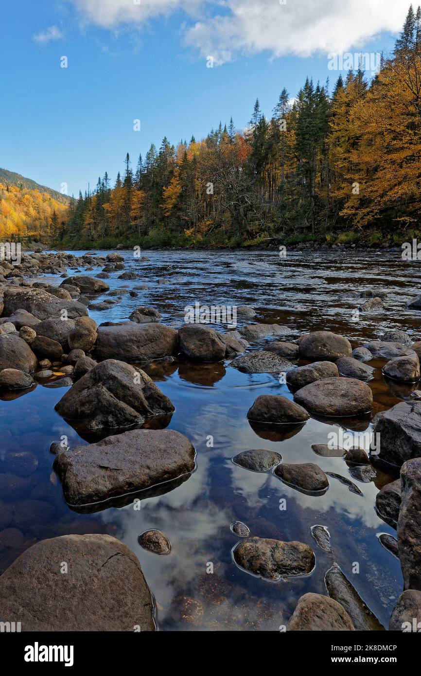 Rocks and sly reflection on the Jacques-Cartier river in the National ...