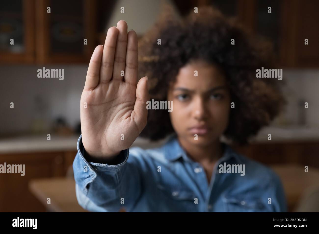 Serious African girl raise her palm makes stop gesture Stock Photo - Alamy