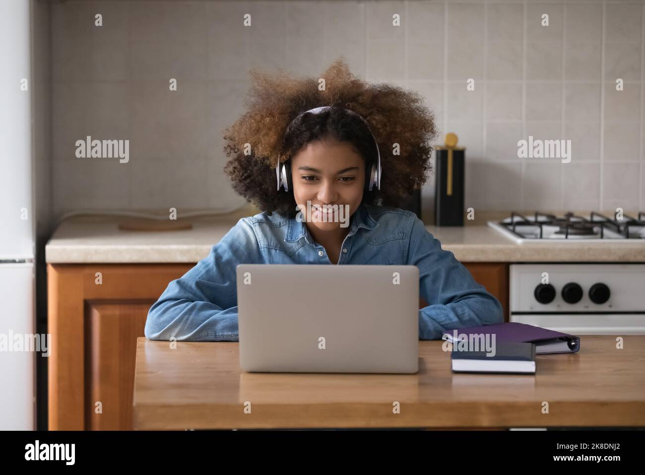 Cute African girl studying on-line at home Stock Photo - Alamy