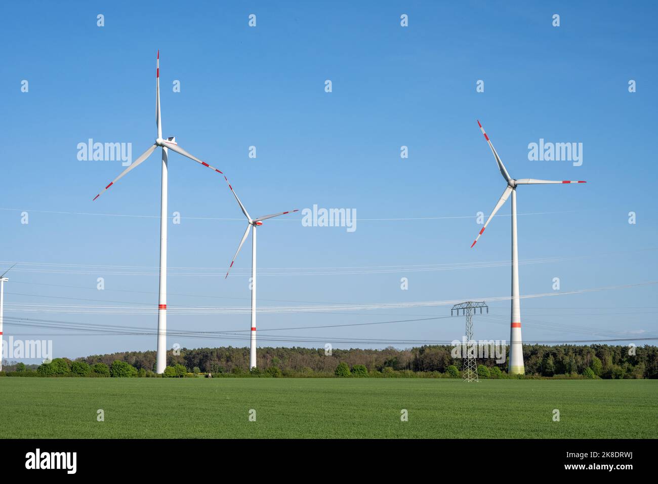 Wind turbines with power lines in the back seen in Germany Stock Photo ...