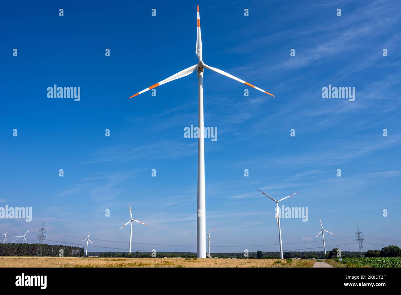 Modern wind turbines with power lines seen in Germany Stock Photo - Alamy