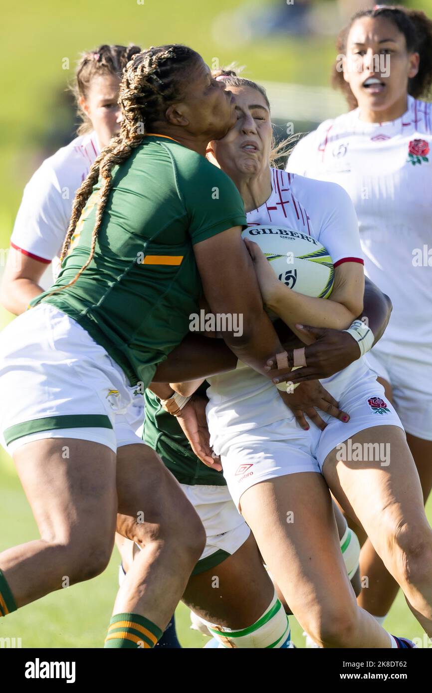 England's Holly Aitchison is tackled by South Africa's Lusanda Dumke ...