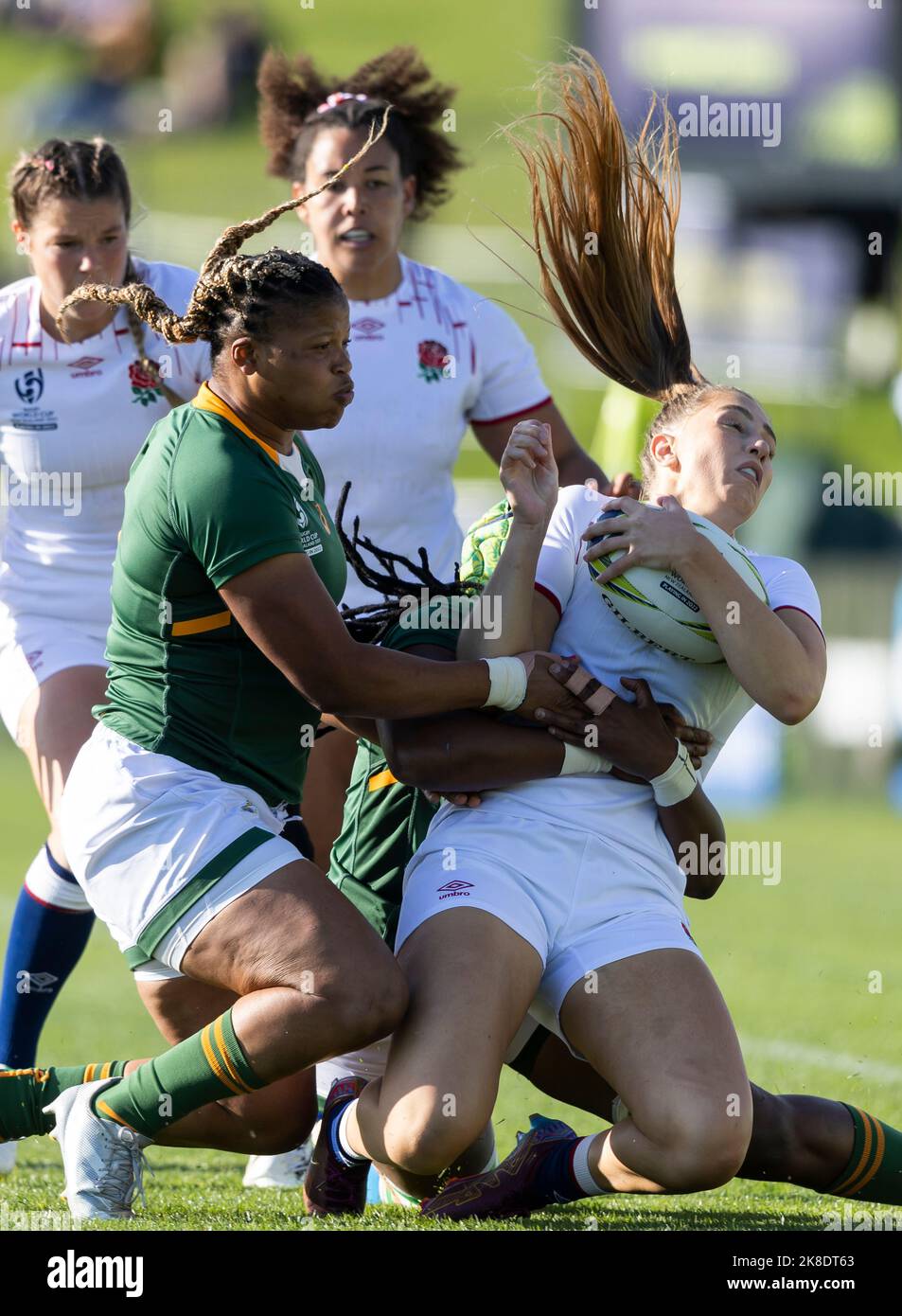 England's Holly Aitchison is tackled by South Africa's Lusanda Dumke ...
