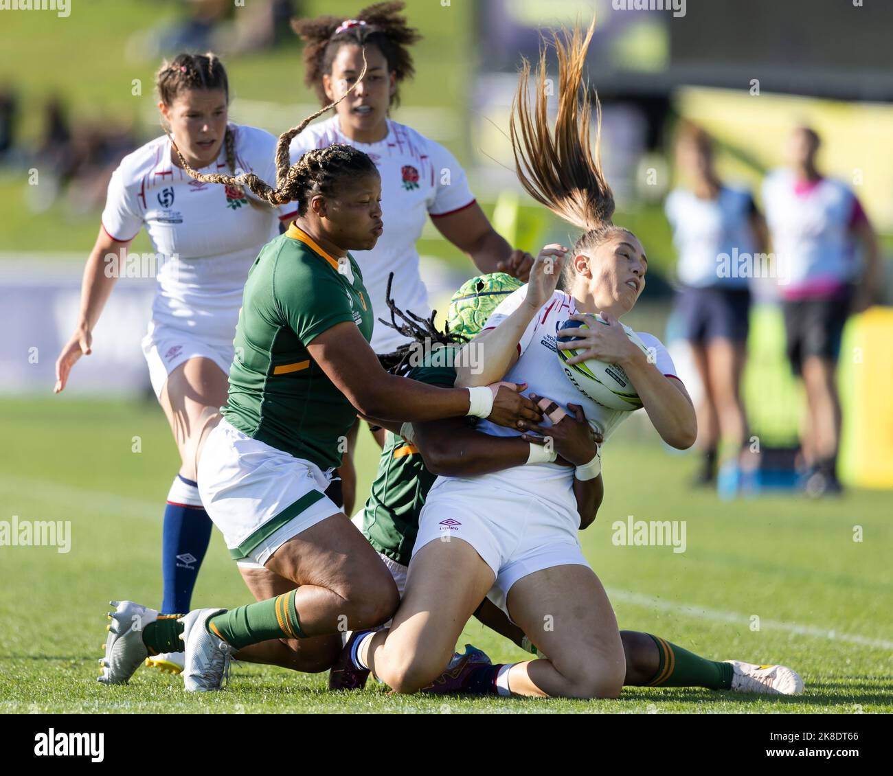 England's Holly Aitchison is tackled by South Africa's Lusanda Dumke ...